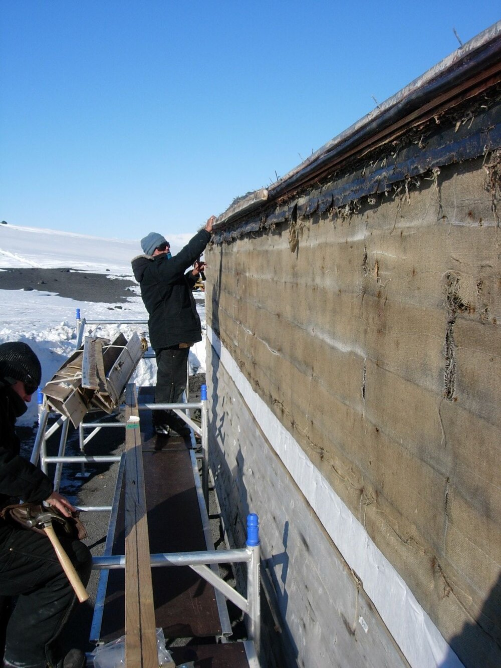 Cladding removed from south wall | Antarctic Heritage Trust